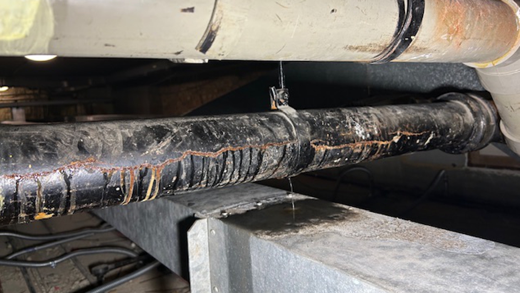 Case Study: Cast Iron Soil Pipe Repair in Hospital Roof Space